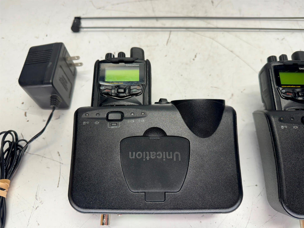 2 Unication G1 VHF Pagers 148-164 MHz w/ Amplified Charger – Used Radios